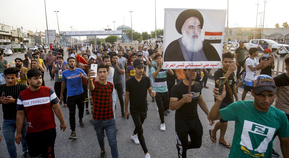 Iraqis rally to decry Saudi paper’s offensive cartoon of Ayatollah ...